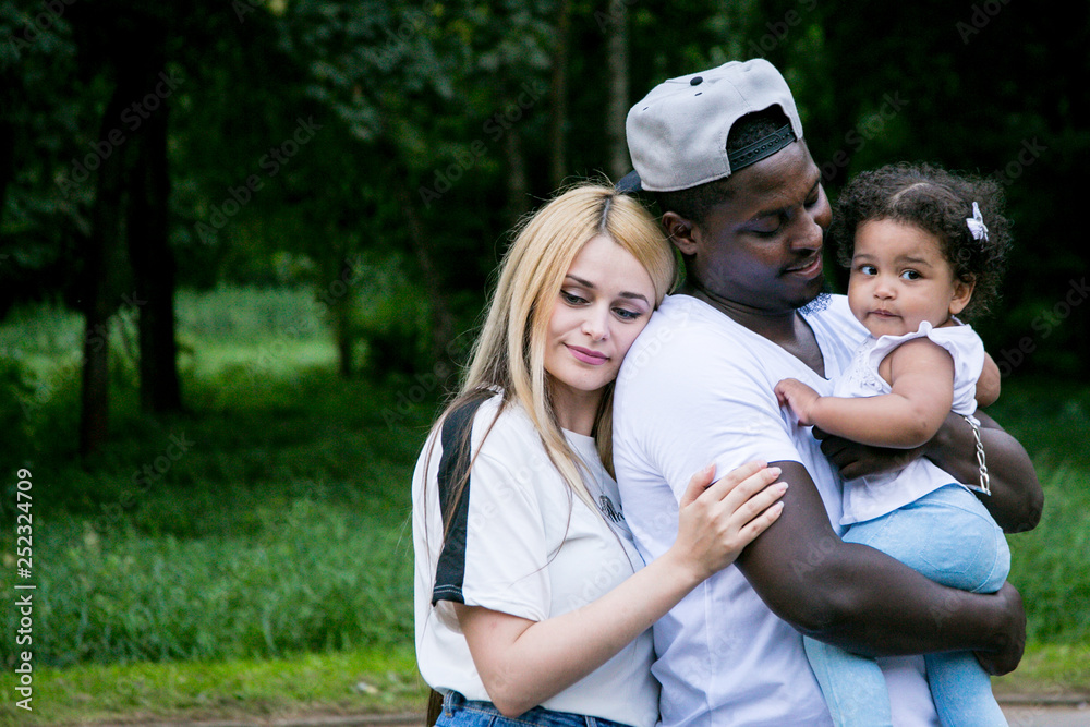 Happy diverse family with daughter at park. Beautiful Diverse Family ...