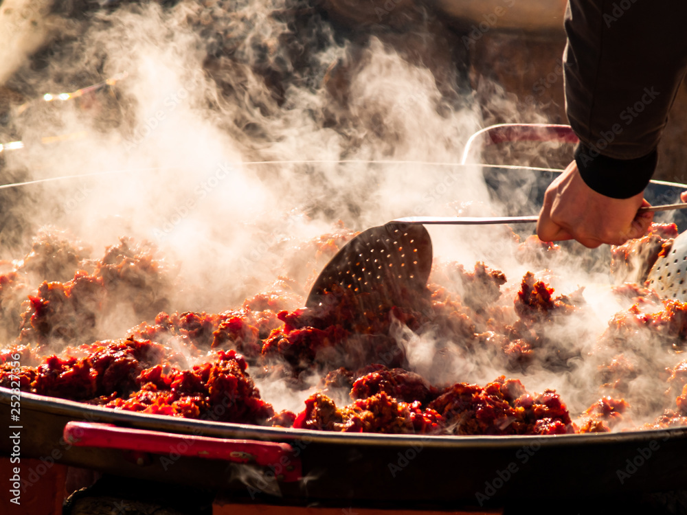 Unrecognizable person cooking traditional food called chichas on the ...