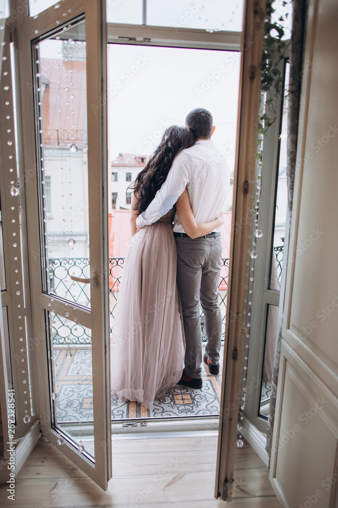 Back view of tender beautiful romantic happy wedding couple hugging ...