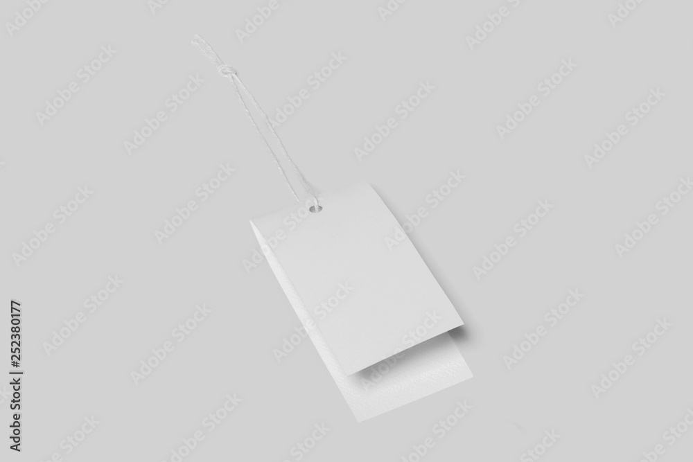 Blank tag tied for hang on product for show price or discount isolate ...