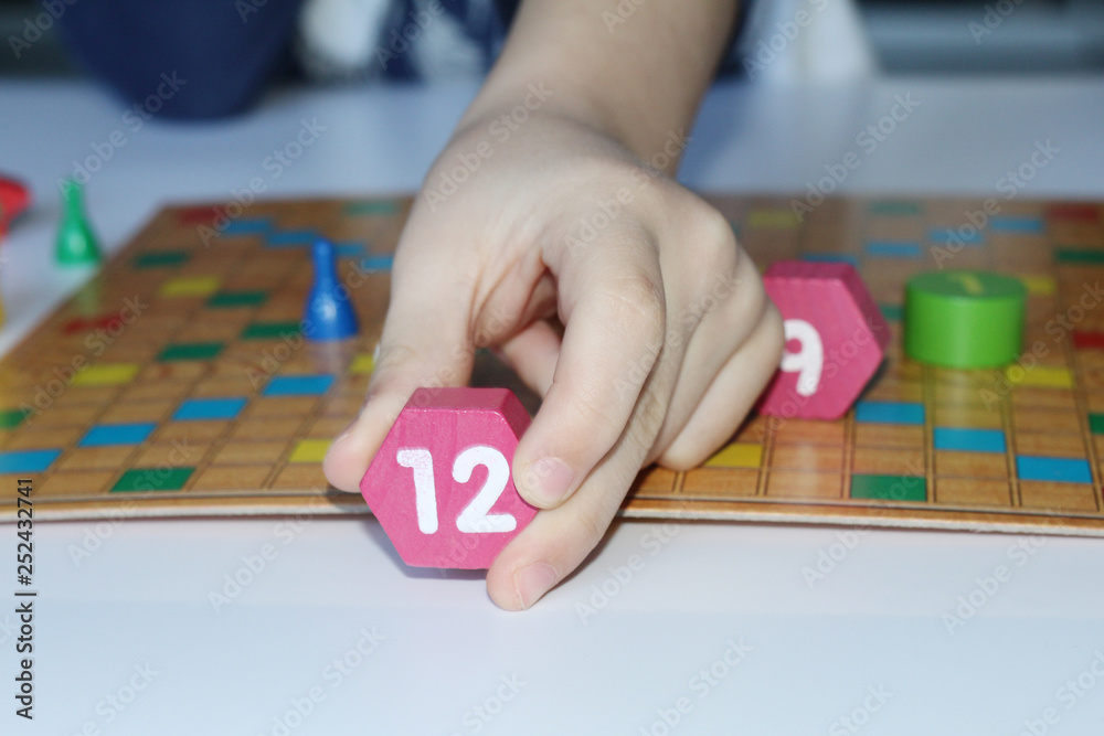 Cube, chips, wooden figures, a bright field for the game. Puzzles for ...