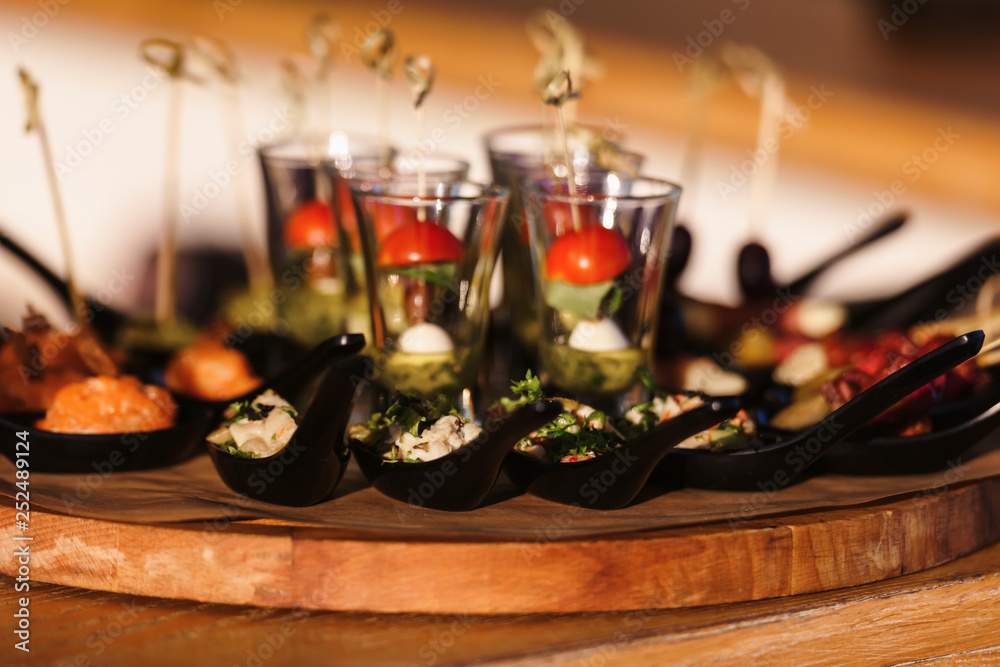 Food snack tray holiday buffet table served by different canape ...