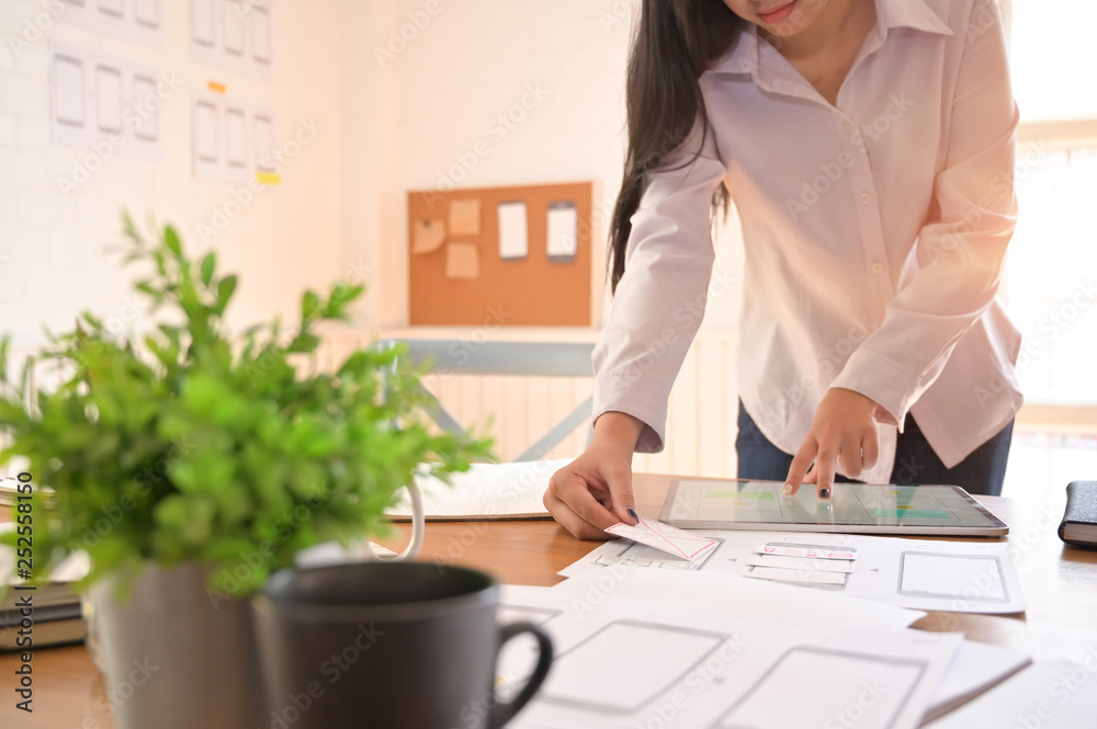 Software developer design a project on paper, UX UI Design concept ...