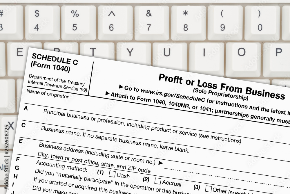 A US Federal tax 1040 schedule C income tax form Stock Photo | Adobe Stock