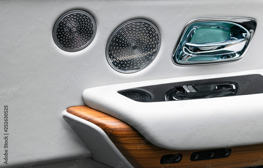 Door handle with power window control buttons of a luxury passenger car ...