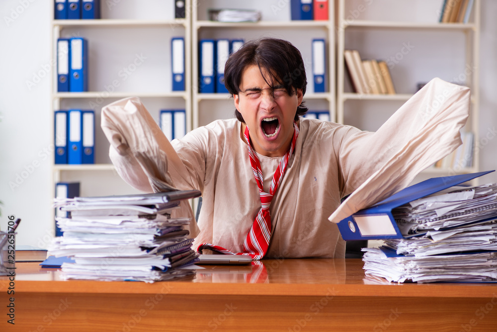 Crazy young man in straitjacket at the office Stock Photo | Adobe Stock