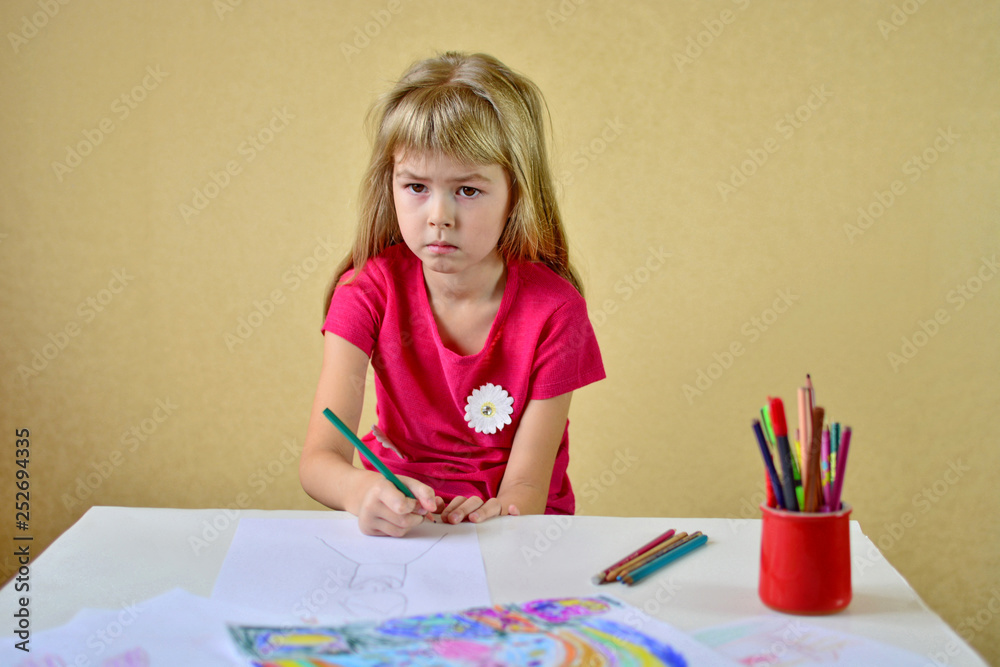 Little girl draws. Beautiful little girl. Drawing lesson. The child ...