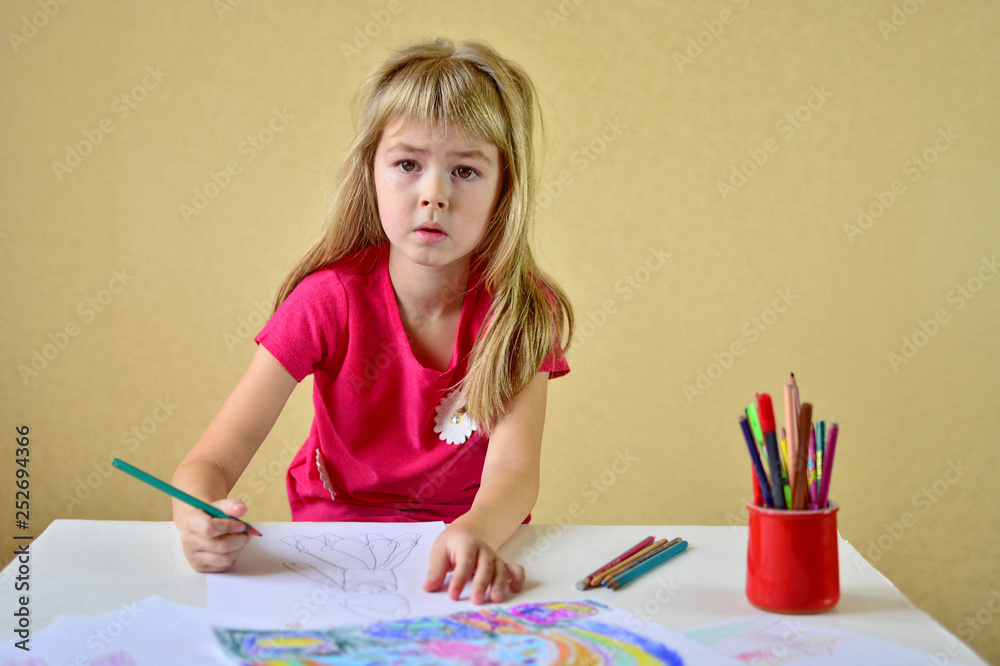 Little girl draws. Beautiful little girl. Drawing lesson. The child ...