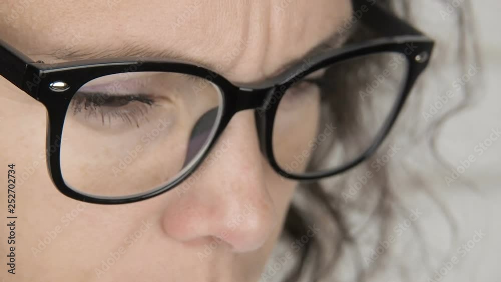 Sad eyes with glasses. Sad eyes of a woman through the lenses of ...