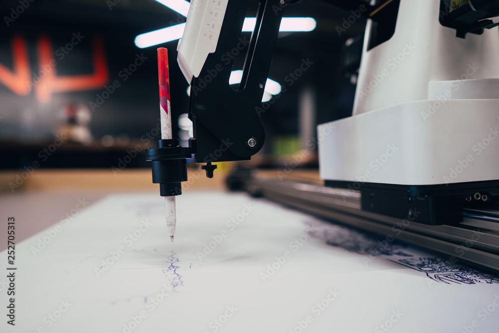 Plotter draws a pen drawing on a sheet of white paper Stock Photo ...