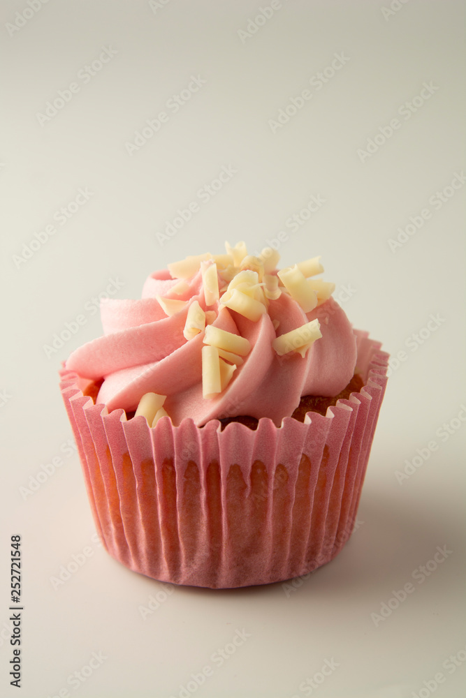 Close up pink, strawbery, fruit cupcakes isoalted. Sweet dessert ...