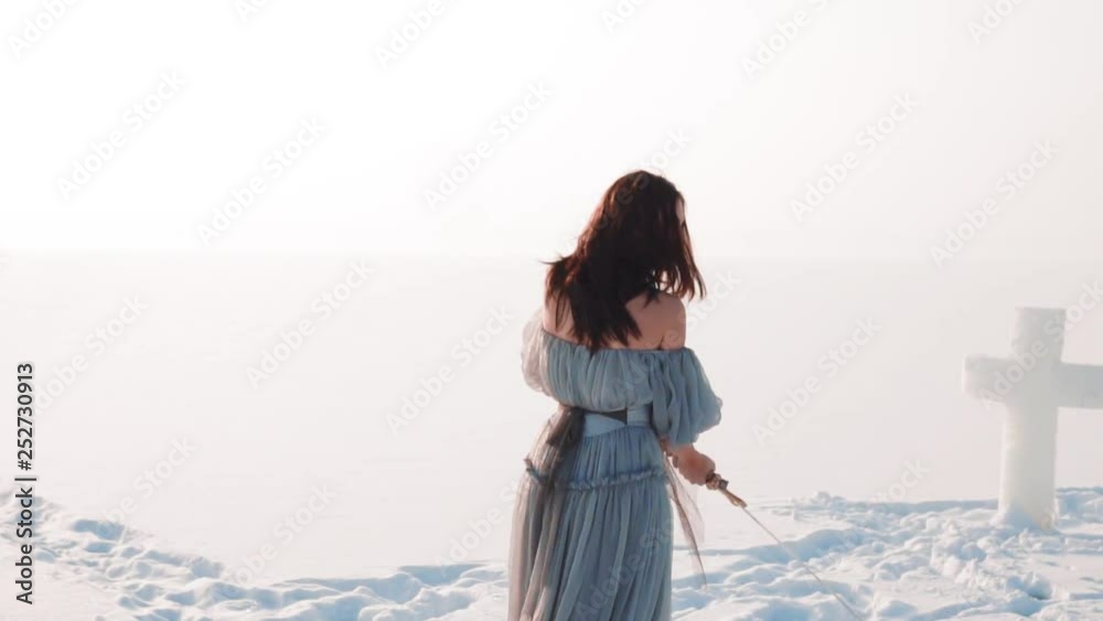 militant brave fearless lady in dark hair falling on her face in long ...