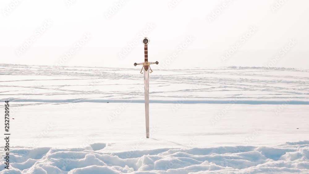 Video Stock mysterious picture of silver royal sword stands alone in ...