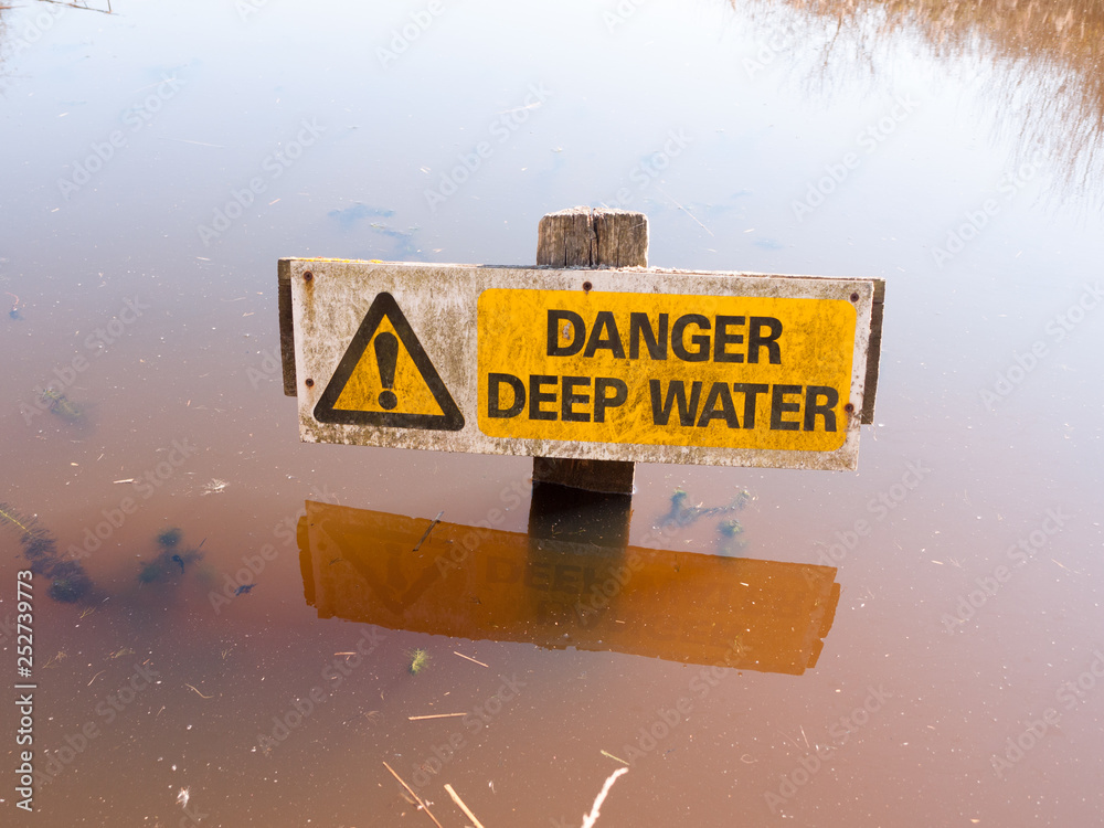 Danger deep water sign water surface careful warning yellow triangle ...