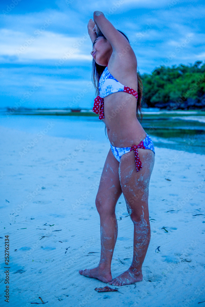 Young Filipino girl at beach in bikini Stock Photo | Adobe Stock