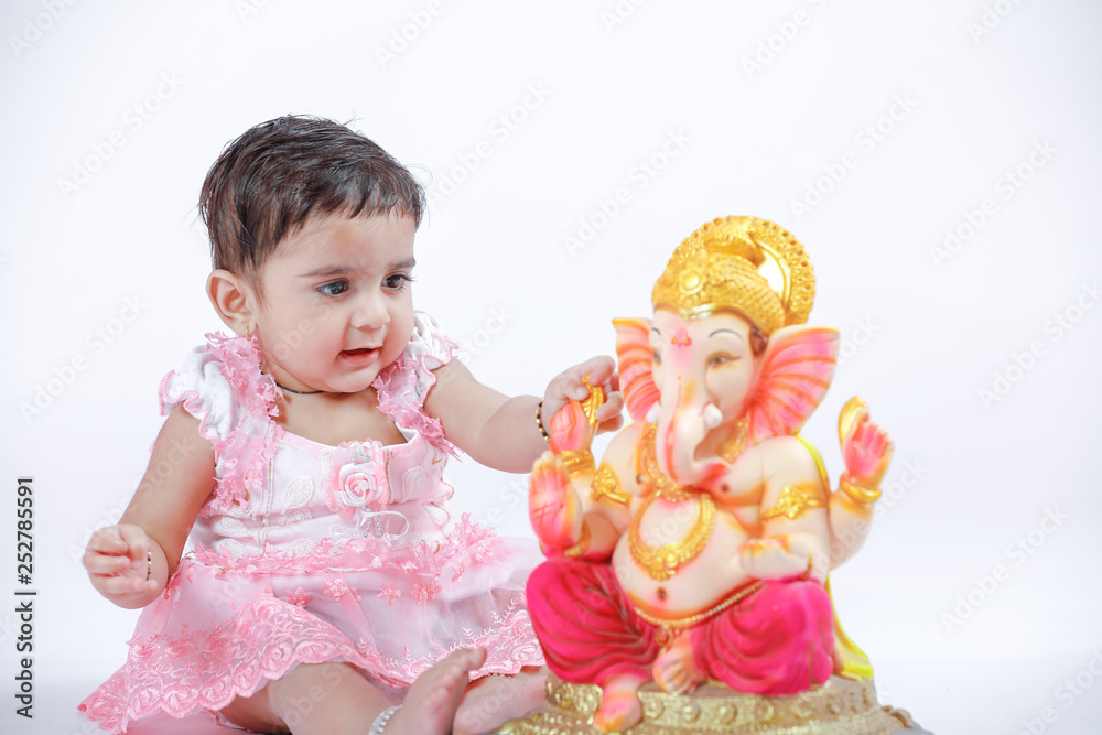 Indian baby girl with lord ganesha and praying , Indian ganesh festival ...