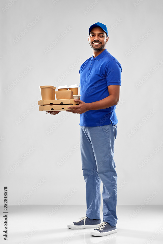 service and people concept - happy indian delivery man with food and ...