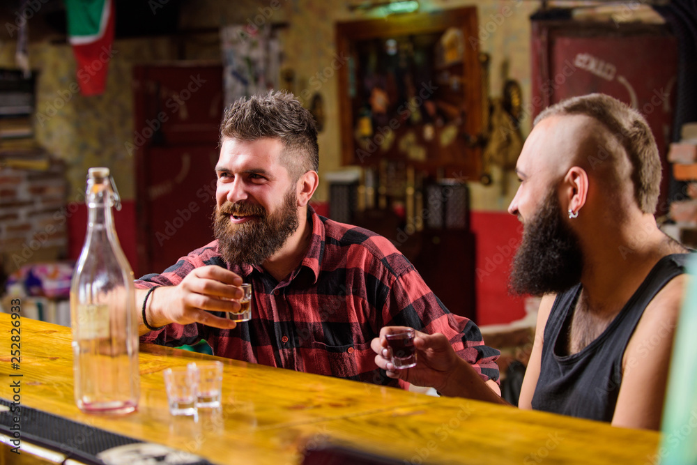Men drinking alcohol together. Alcohol addiction. Hipster brutal man ...