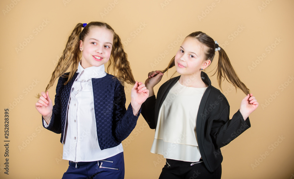 Hairstyle for female. Cheerful friends made same hairstyle for fun. We ...