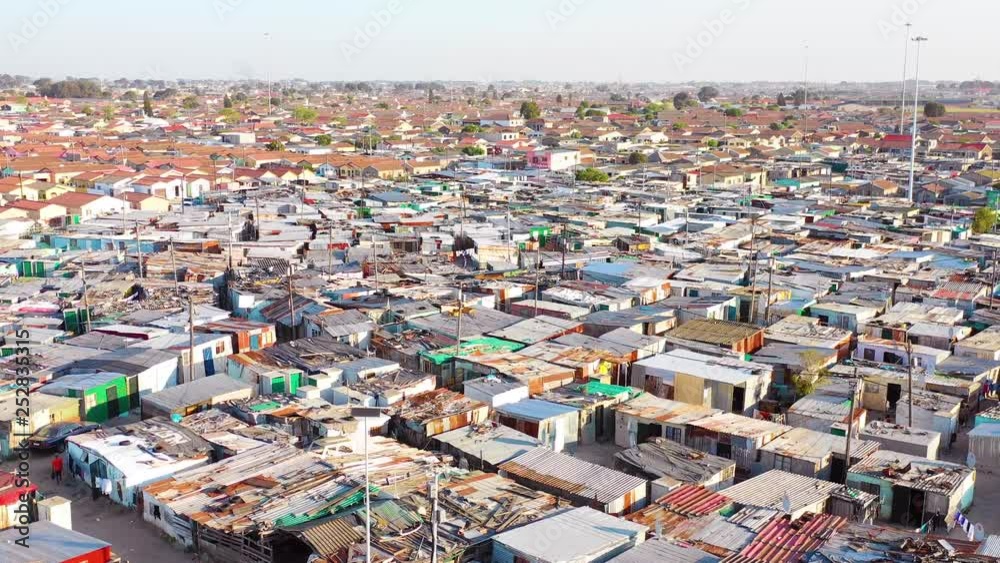 Aerial over contrasting townships of South Africa, with poverty ...