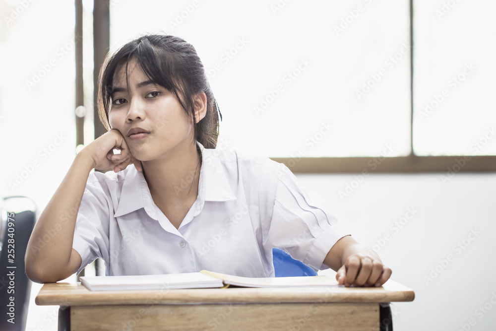 Asian girl Students thinking reading paperwork exams at examination ...