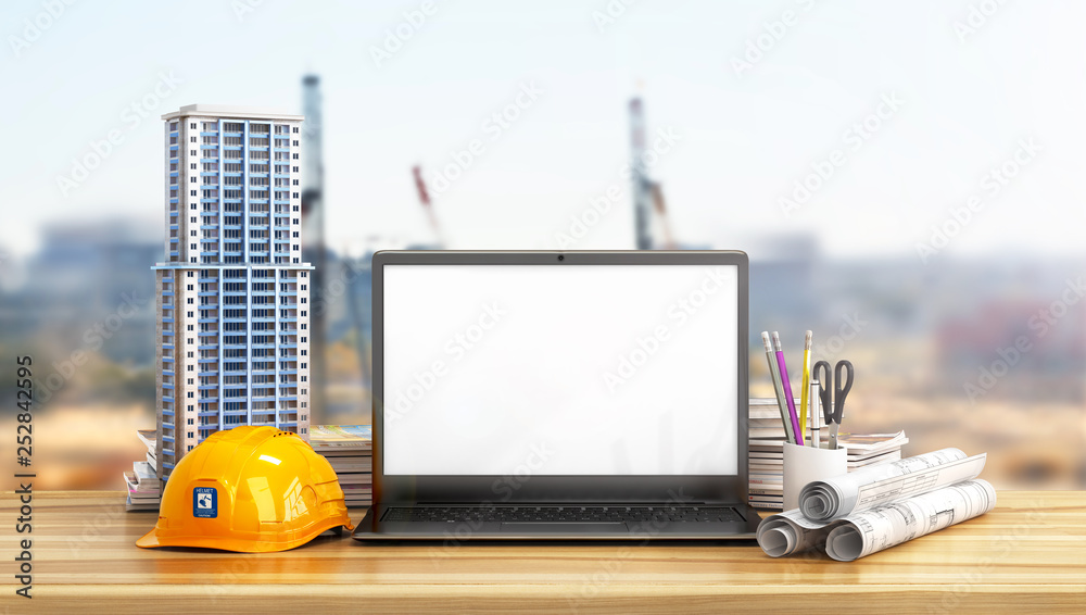 House layout, drawing projects, helmet and open laptop with blank ...