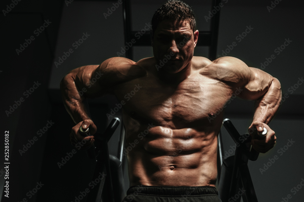 Handsome strong athletic men pumping up muscles workout push ups on ...