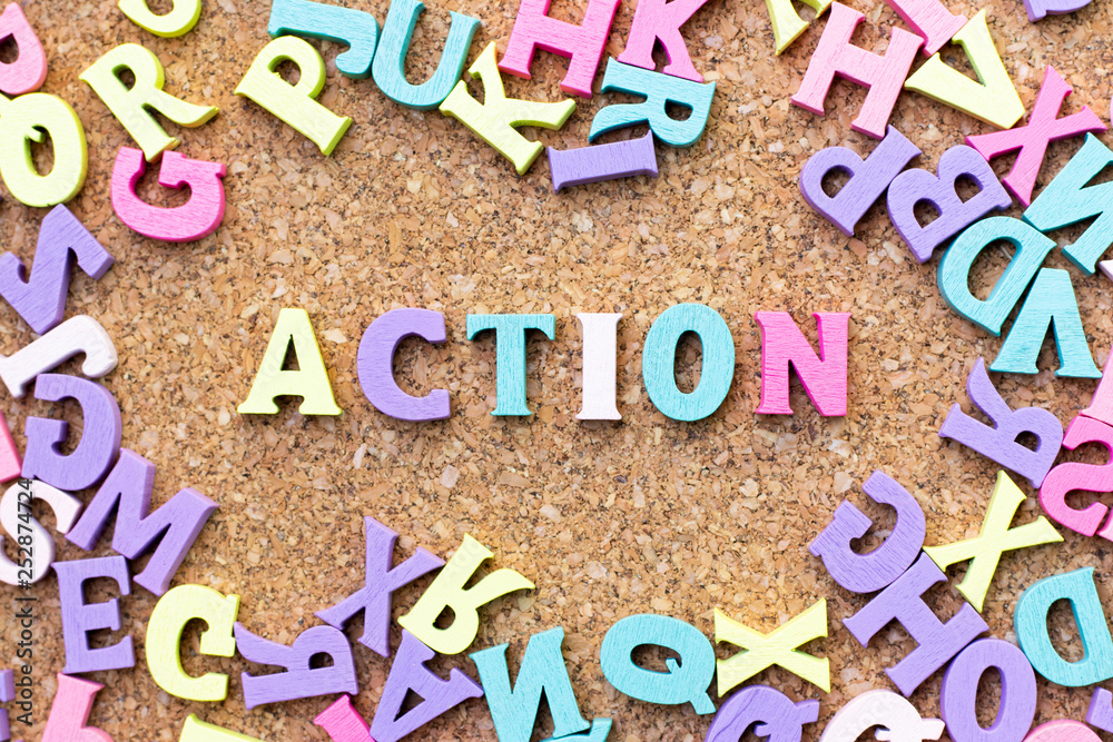 Color alphabet in word action with another letter as frame on cork ...