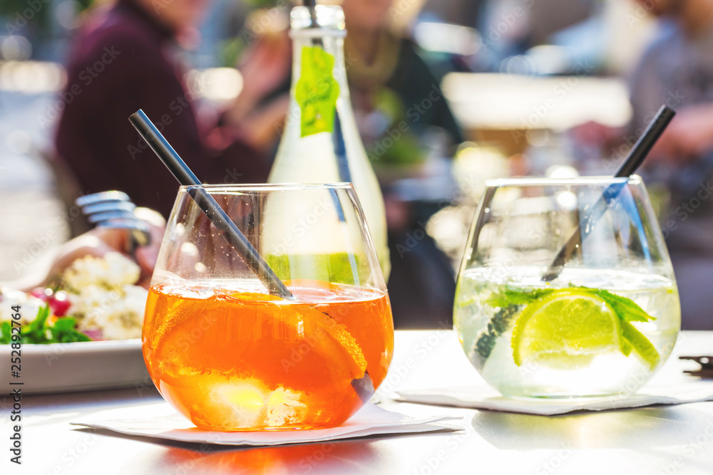Aperol spritz and HUGO cocktail in misted glass, selective focus ...