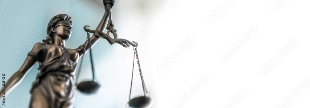 Statue of lady justice on bright background - Side view with copy space ...