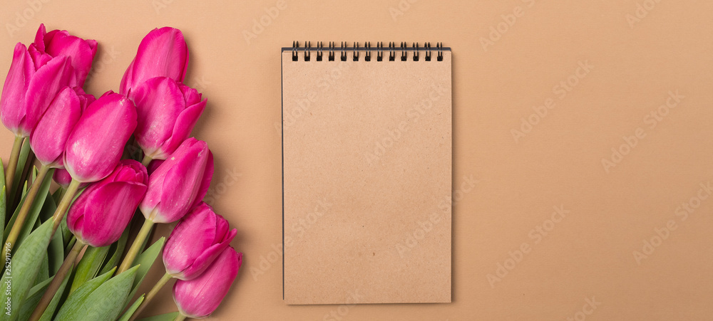 Spring mood. Spring beige background with spring pink flowers and ...