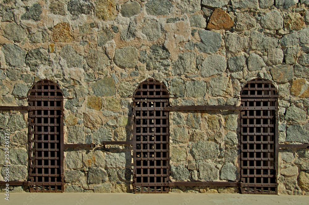 Three Iron doors and fieldstone boulder wall. Yuma Territorial Prison ...