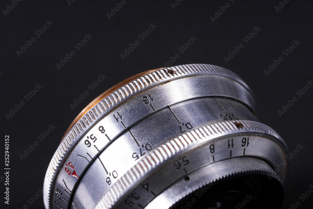 Old vintage lens scales symbols closeup view. Photo with blurred gray ...