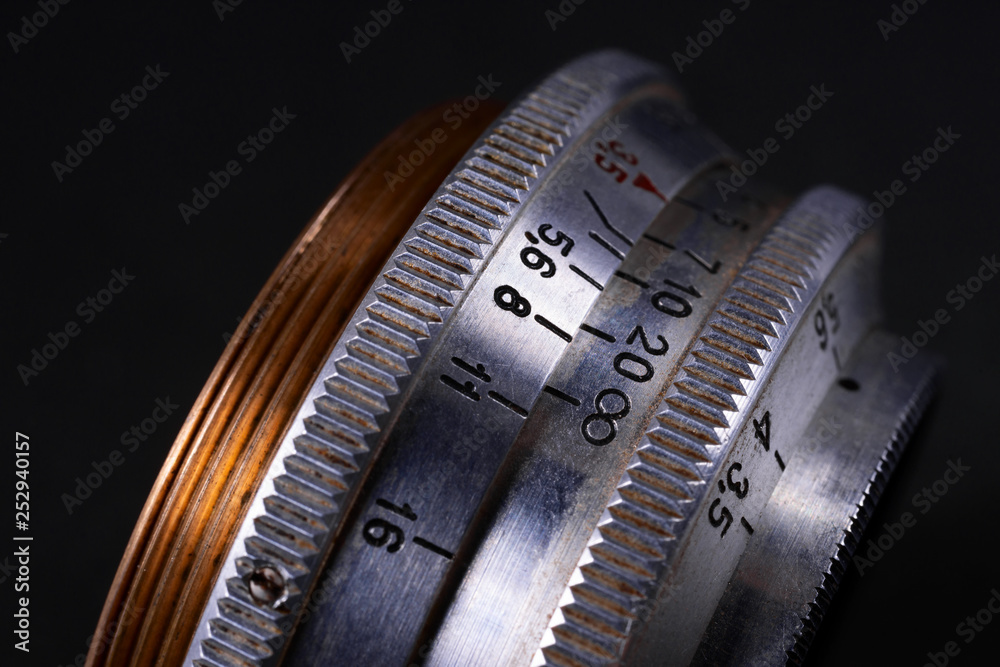 Old vintage lens scales symbols closeup view. Photo with blurred gray ...