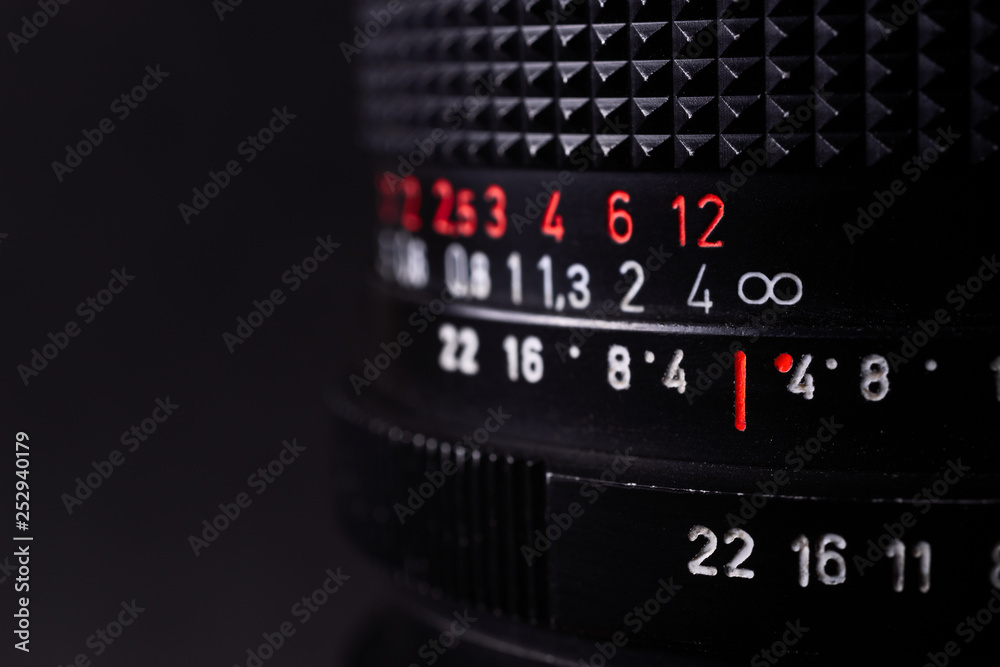 Vintage lens scales symbols closeup. Stock photo with blurred gray ...