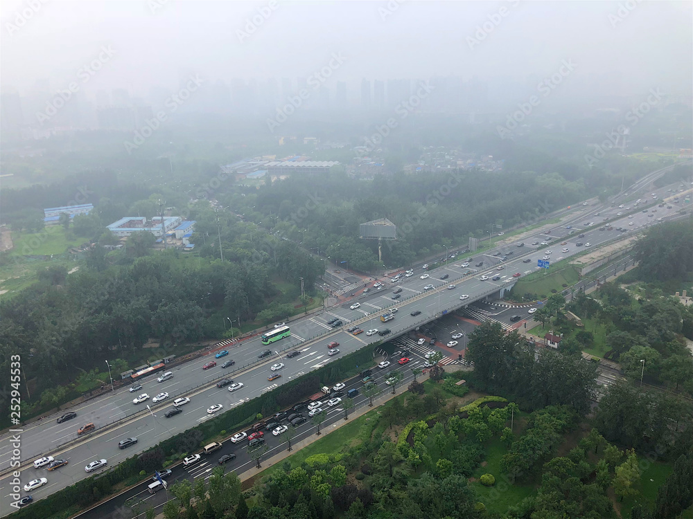 Top view highway with severe air pollution, fog and haze in Beijing ...