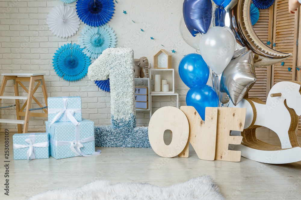 Birthday gold and silver decorations with gifts, toys, garlands and ...