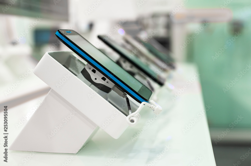 Smartphones on shelf in the store. Concept for communications and ...