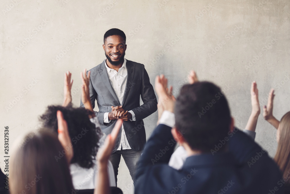 Audience Clapping Hands To Speaker After Business Seminar Stock Photo audience-clapping-hands-to-speaker-after-business-seminar-stock-photo