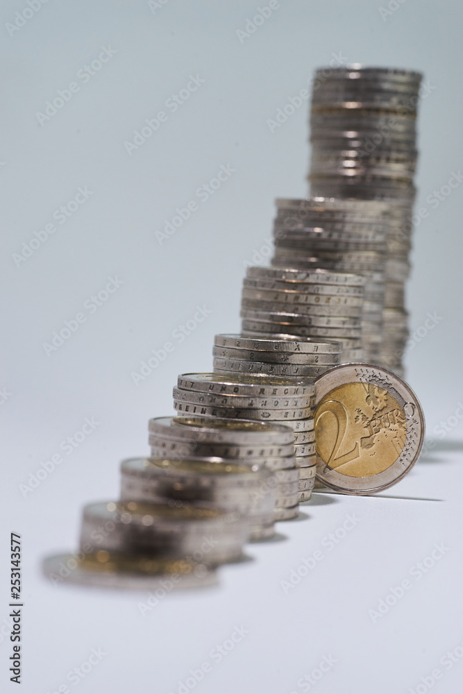 Coin lader isolated on white background with some coins blurred could ...