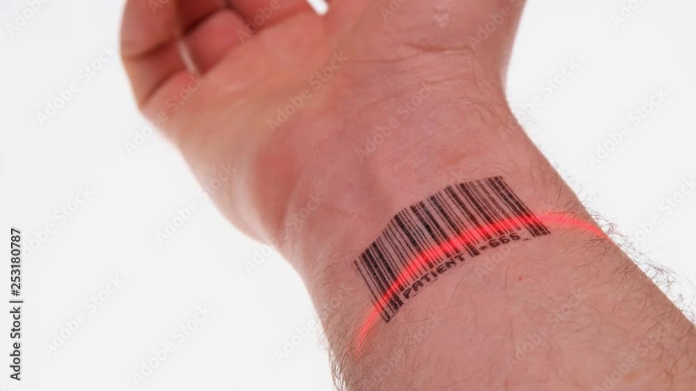 the scanner scans the wrist of a person with a barcode labeled patient ...