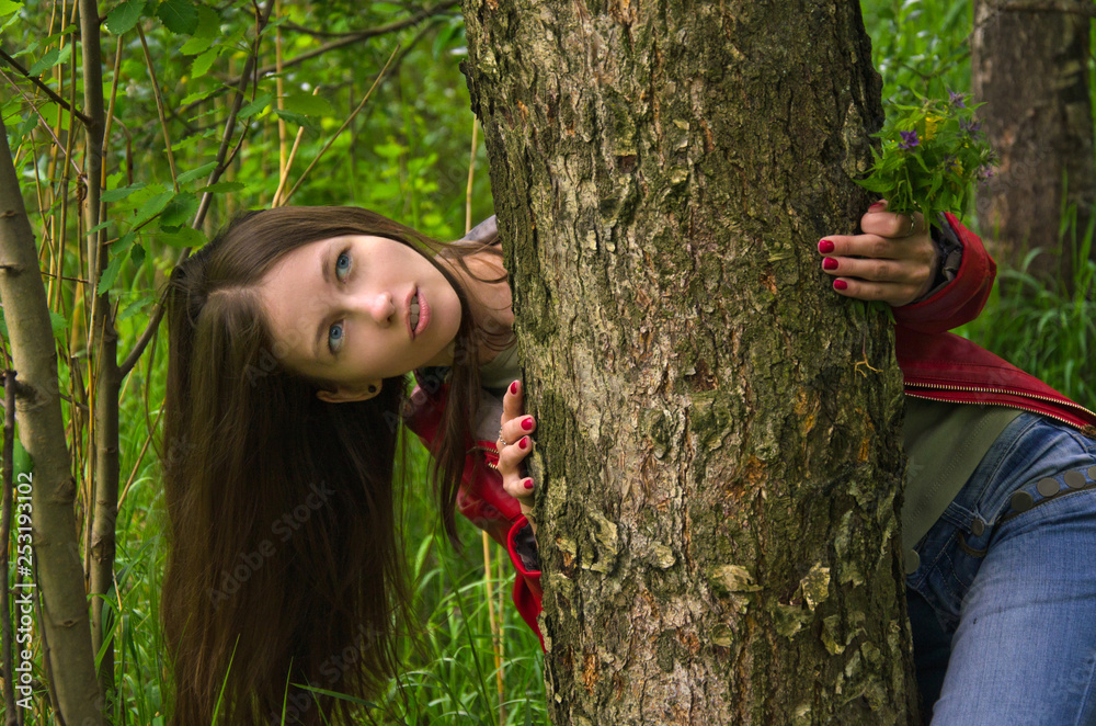 Scared Girl Hiding Behind Tree
