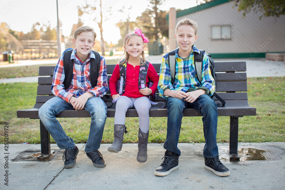 School kids on bench Stock Photo | Adobe Stock