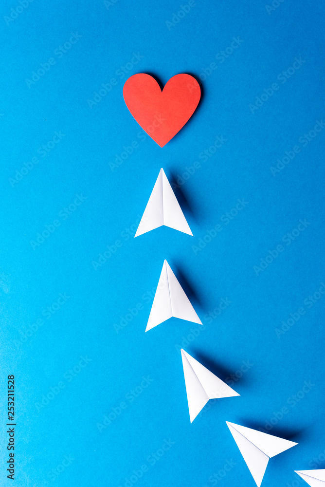 Design love card. Paper origami white airplanes with red heart shape ...