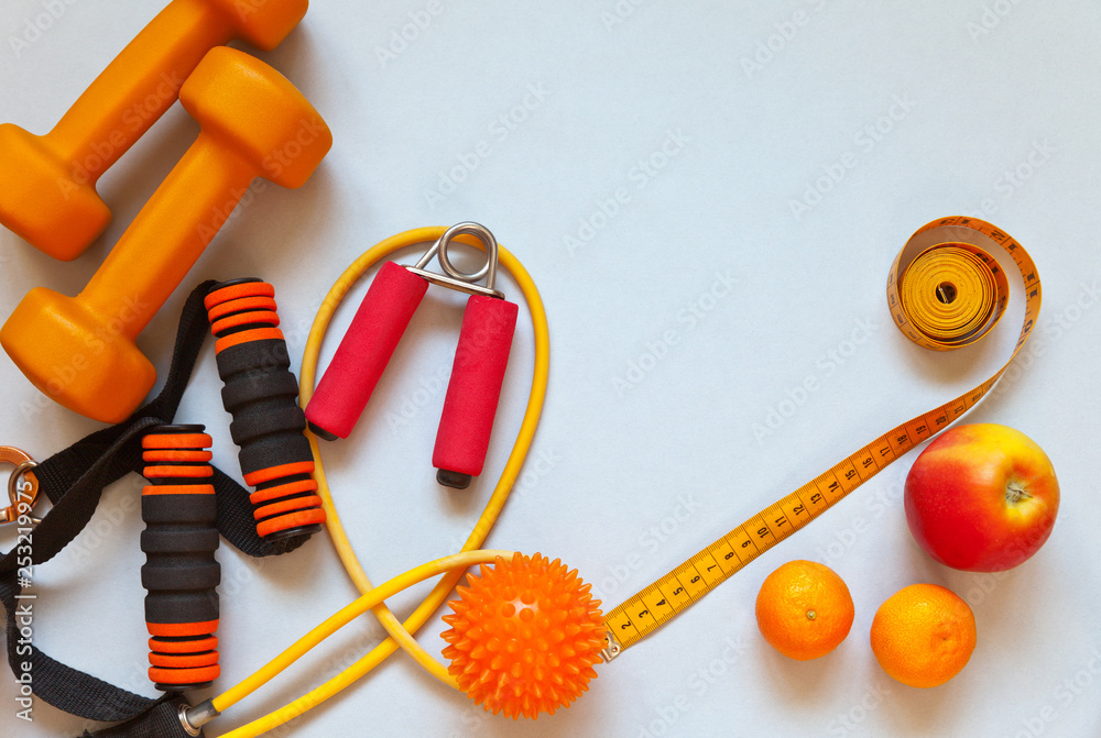 Bright equipment for physical exercise: dumbbells, rubber chest ...