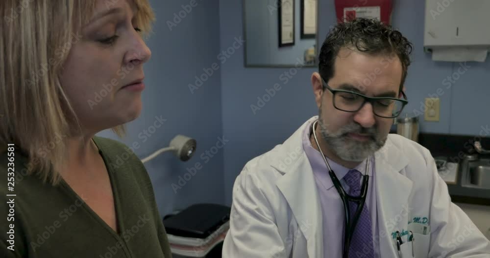 Doctor Listening Carefully To A Patient While Typing Notes On A doctor-listening-carefully-to-a-patient-while-typing-notes-on-a