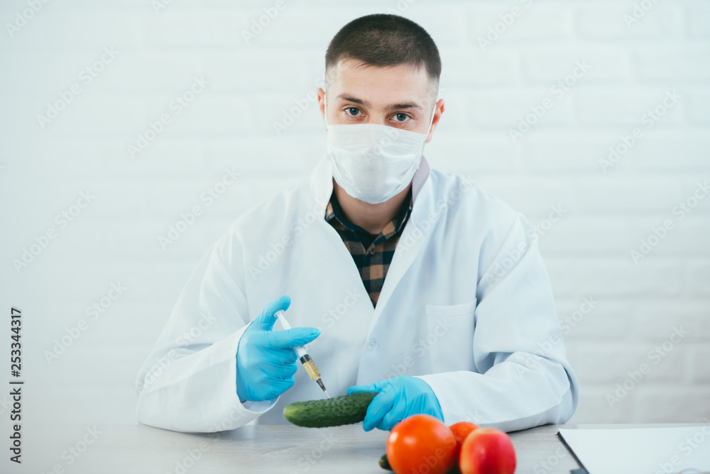 lab technician in lab coat and gloves colitis nitrates and GMO in ...