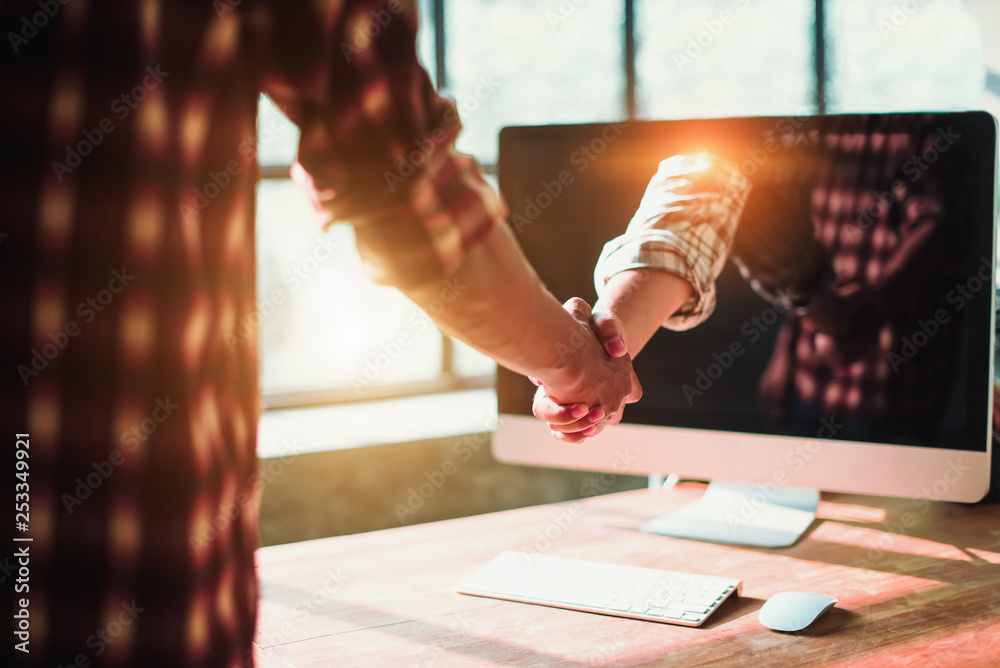Hand reaching out from computer screen to shake hand - Image Stock ...