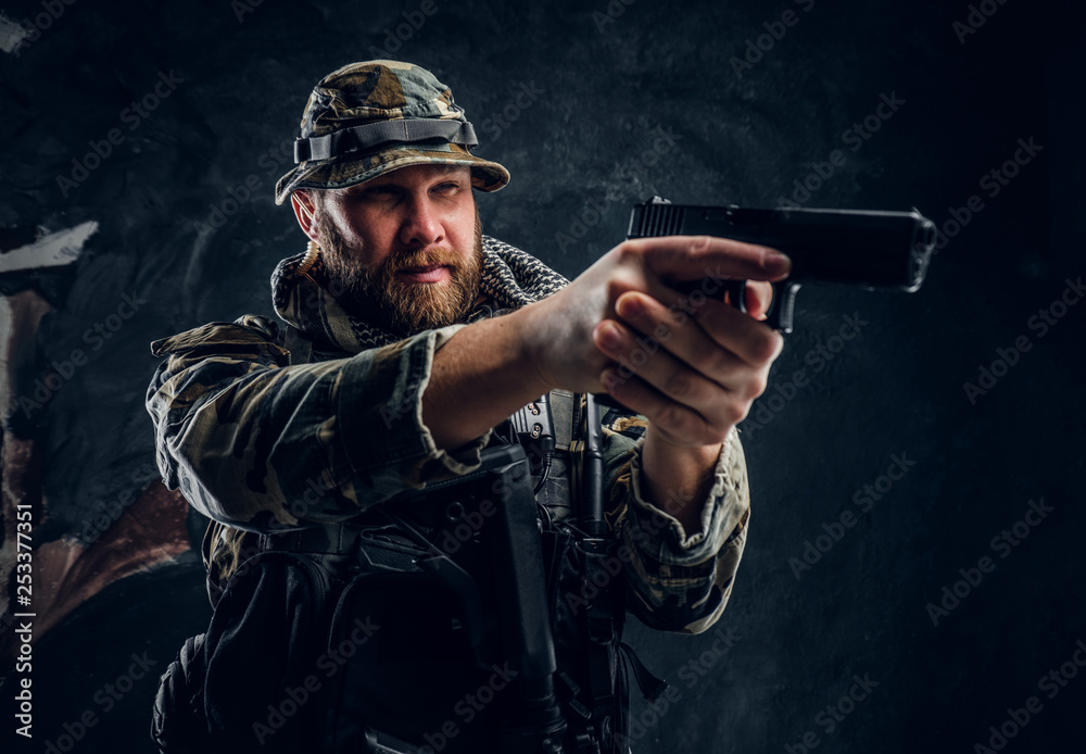 Brutal special forces soldier in the military camouflaged uniform ...