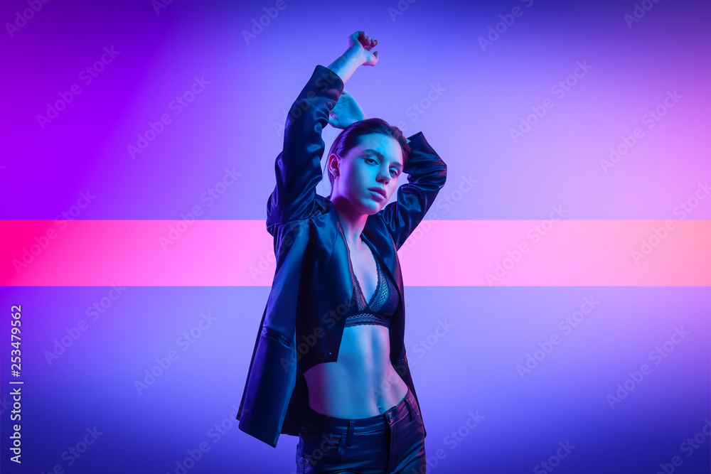 Cinematic night portrait of woman in neon. High Fashion model girl in ...